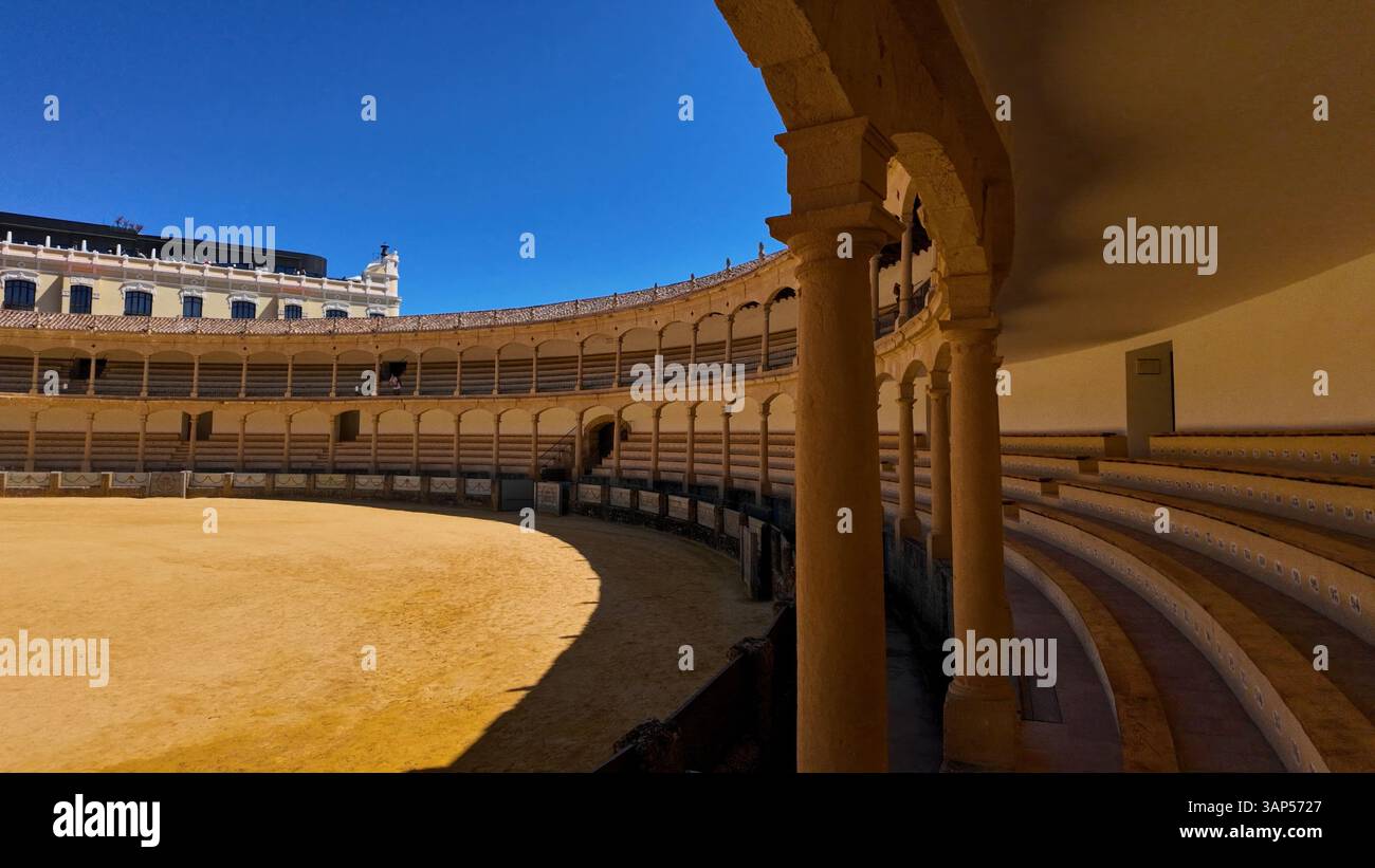 Large circular bullring arena made of sand and surrounded by stepped ...
