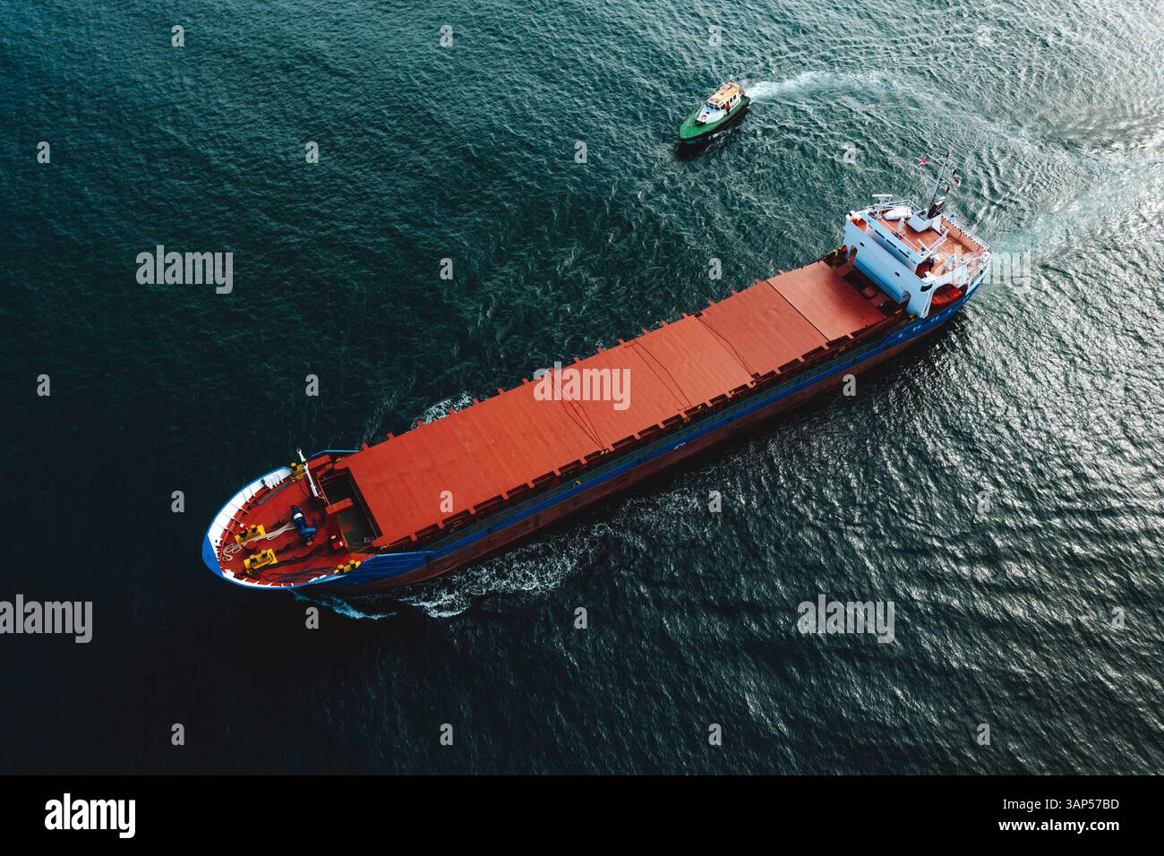 Aerial view of cargo ship leaving the harbour in Valletta, Malta island ...