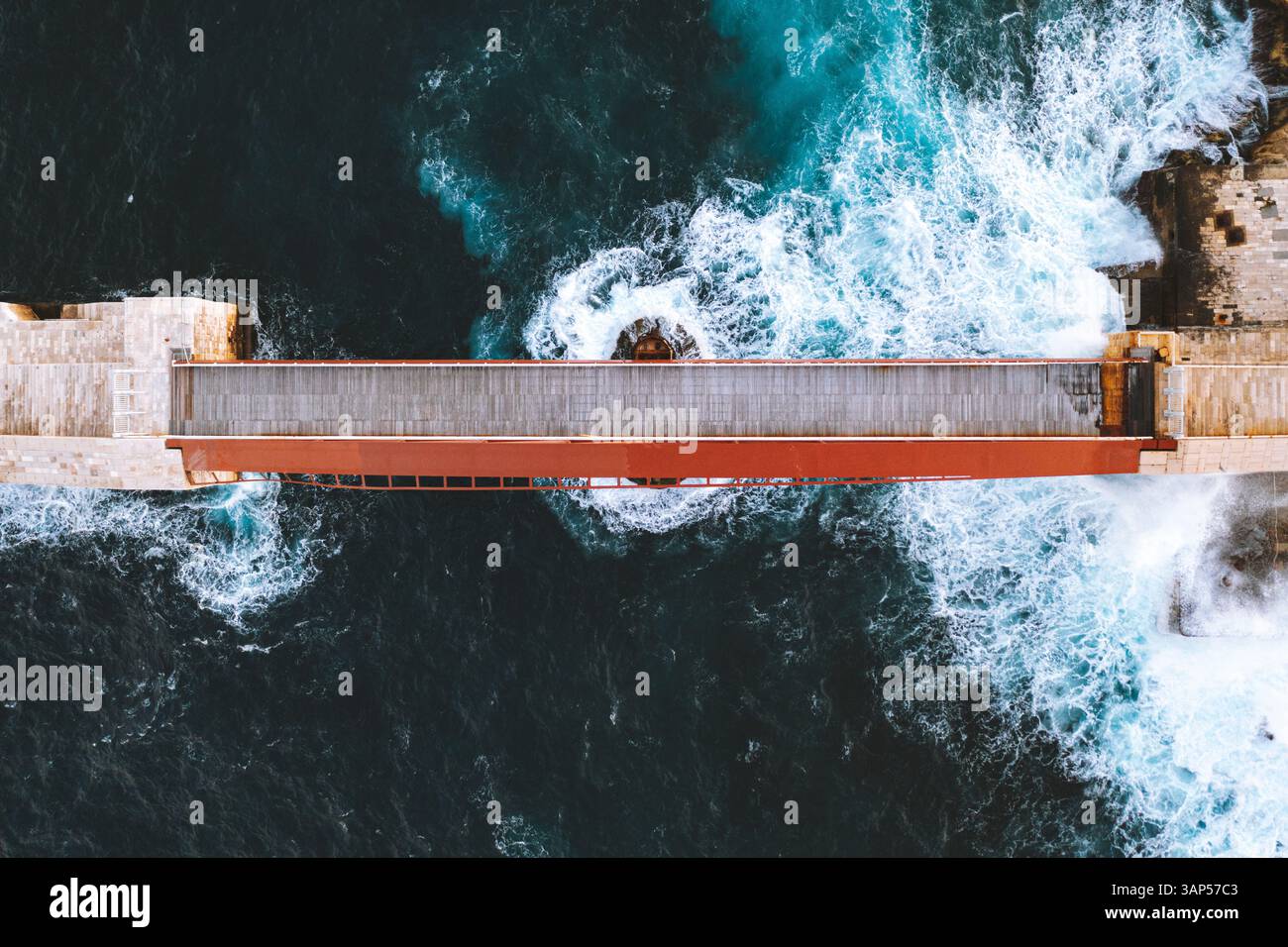 Aerial top down view of bridge over Mediterranean Sea between pier and ...