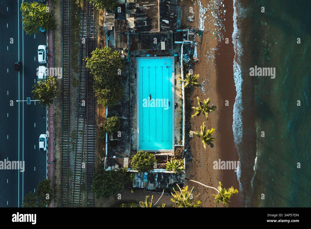 Aerial top down view of public open air swimming pool on the beach in ...