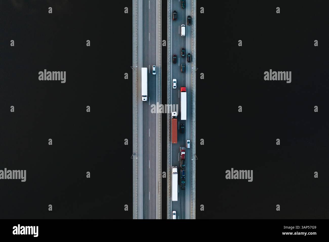 Aerial view of traffic vehicles driving on the highway bridge over the ...
