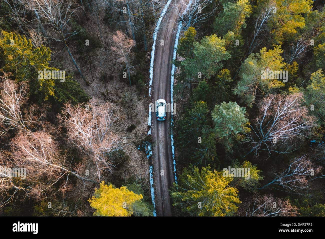 Aerial top down view of silver car driving in off-road way in the ...