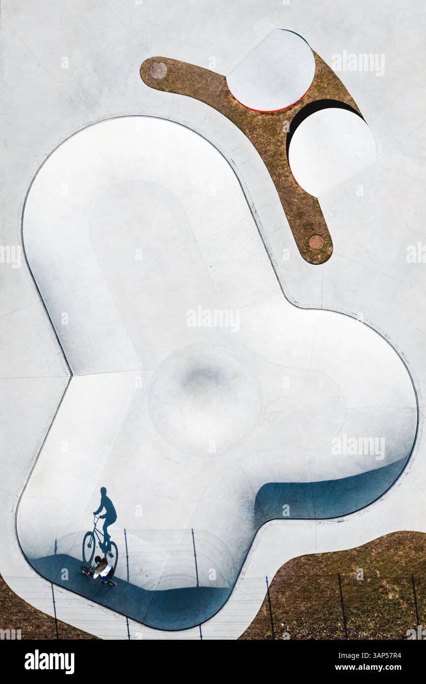 Aerial top down view of BMX bike rider silhouette shadow riding in ...