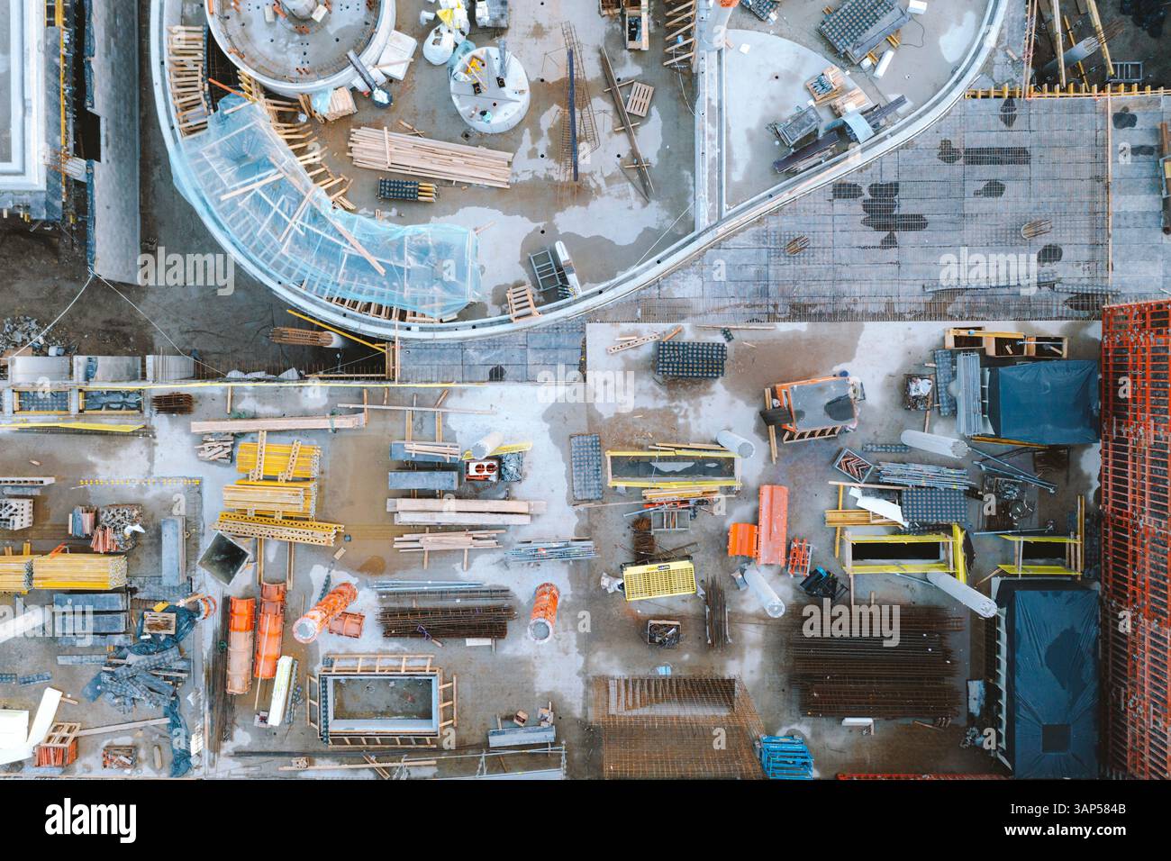 Aerial top down view of outdoor building activity site in progress from ...