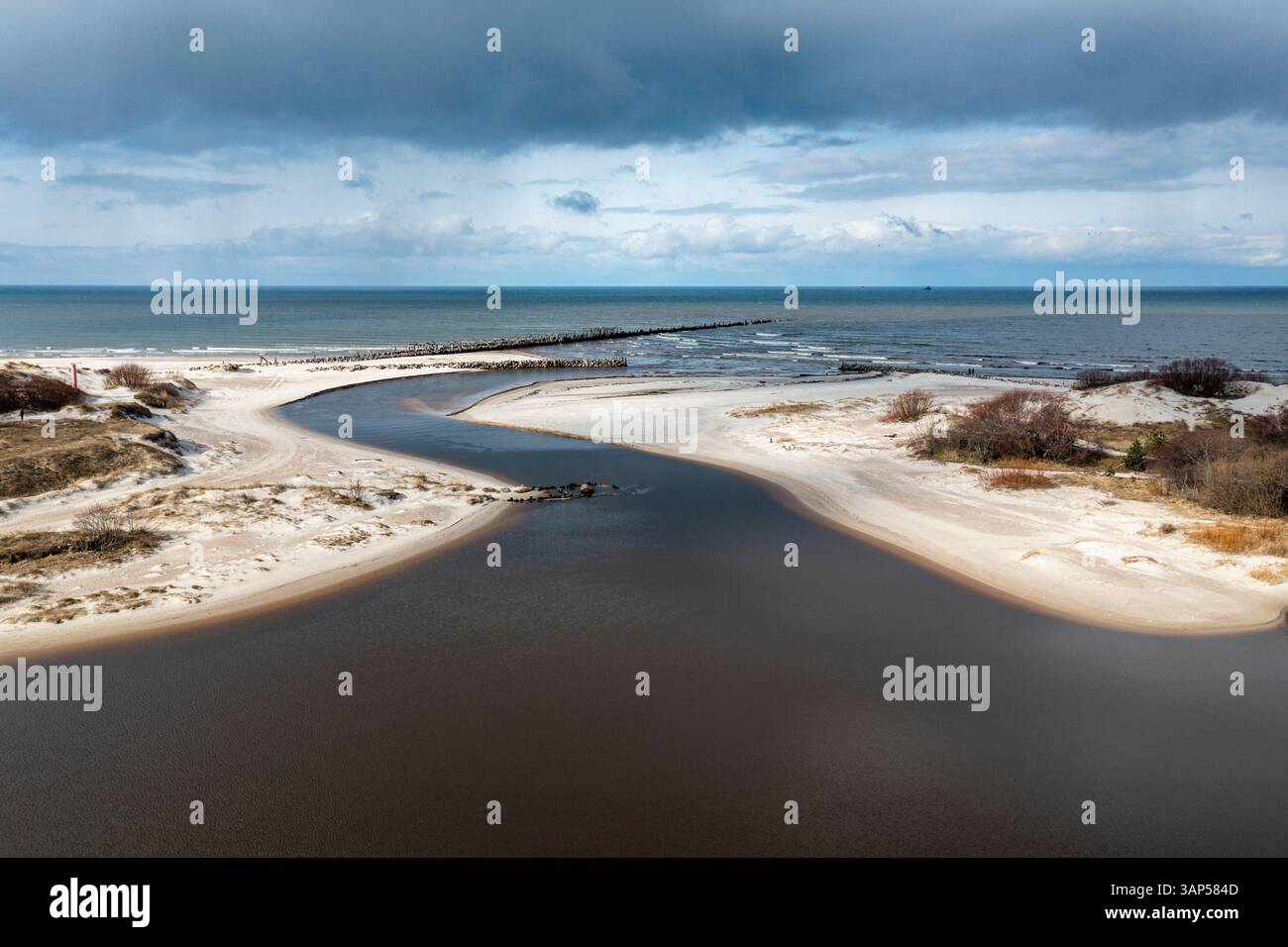 Aerial view of Sventoji river entering Baltic sea, Sventoji, Lithuania ...