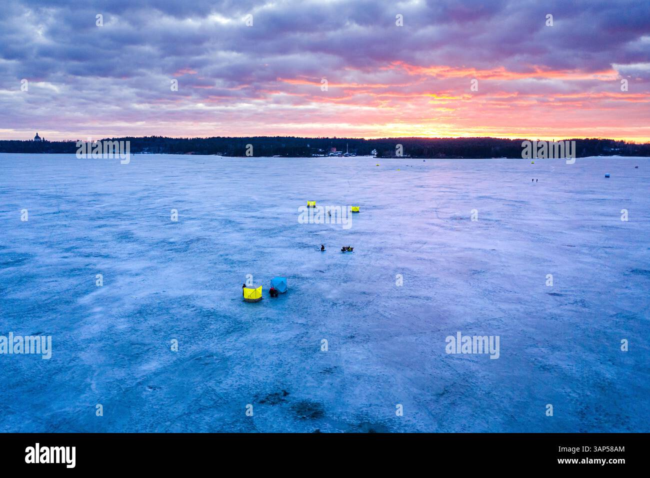 Aerial view of fishermen ice fishing on the frozen Neman river in ...