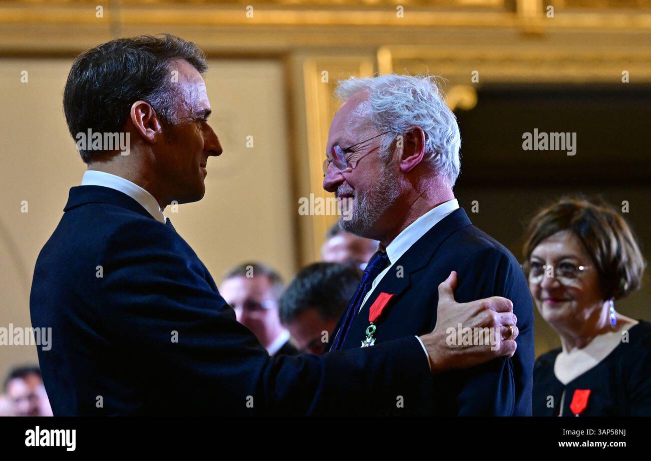 Paris, France. 15th Apr, 2025. French President Emmanuel gives a medal ...