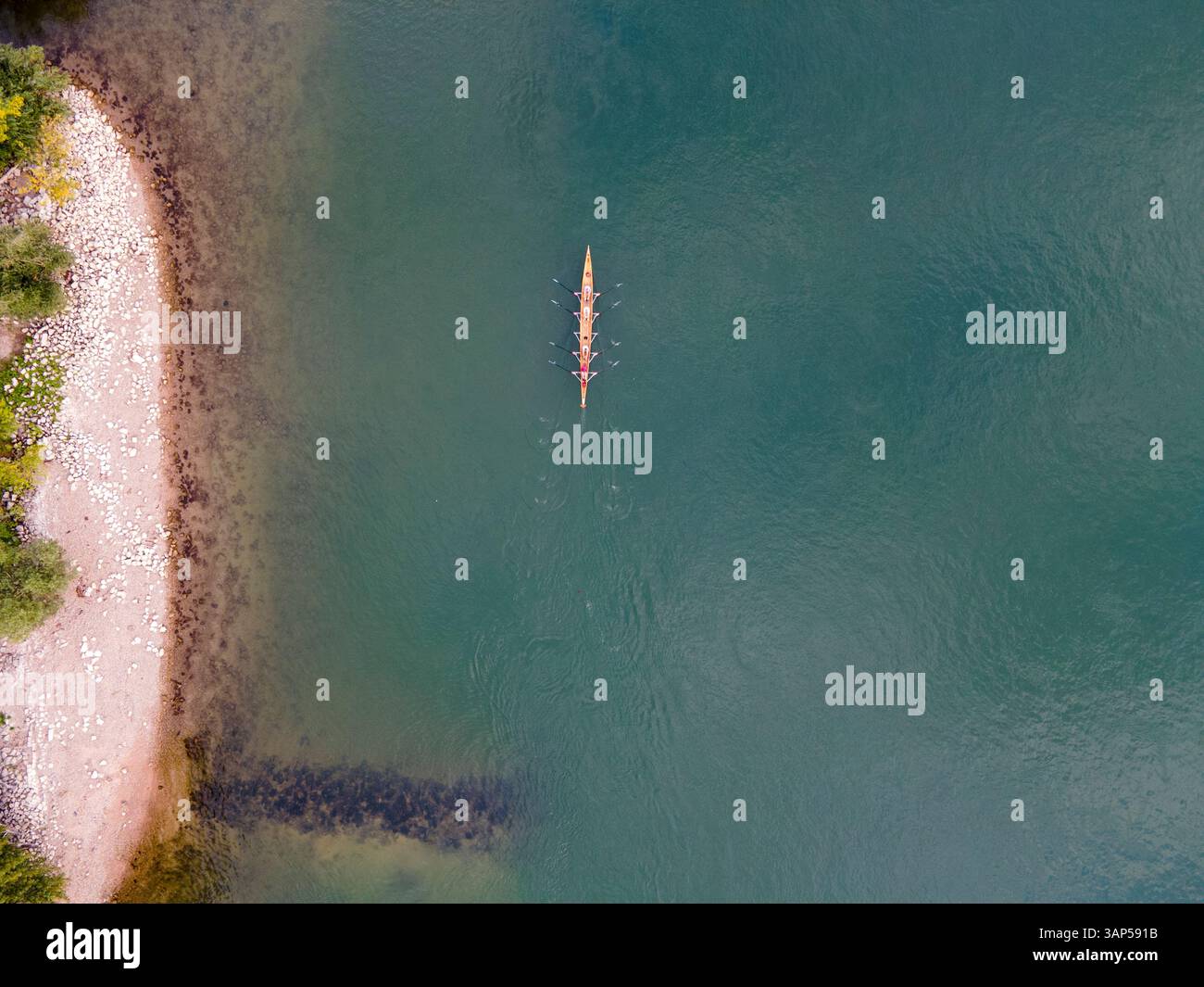 Aerial view of the serene Neckar River with kayakers and lush green ...