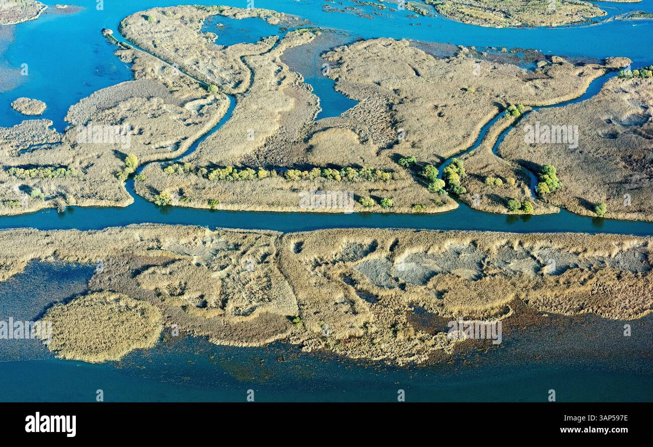 Aerial view of serene wetlands and winding channels with islands and ...