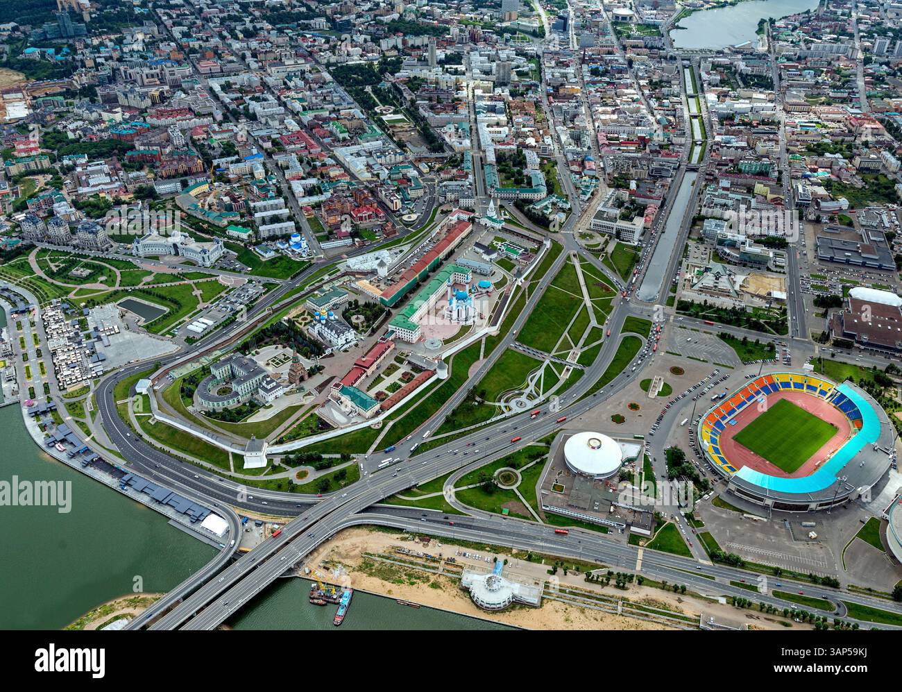 Aerial view of a beautiful urban landscape featuring a stadium, roads ...