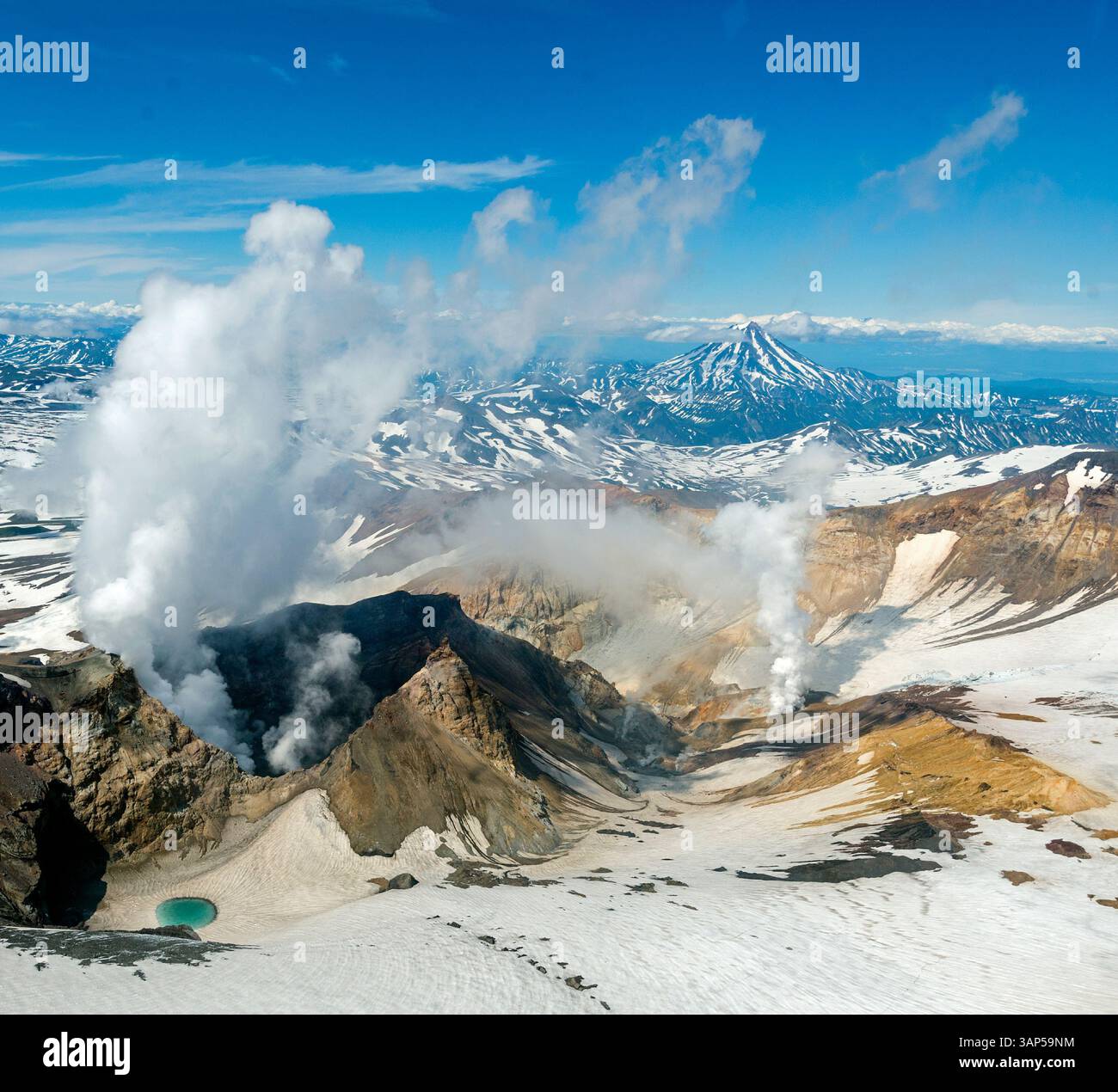 Aerial view of gorely volcano with smoke and snow in a scenic landscape ...