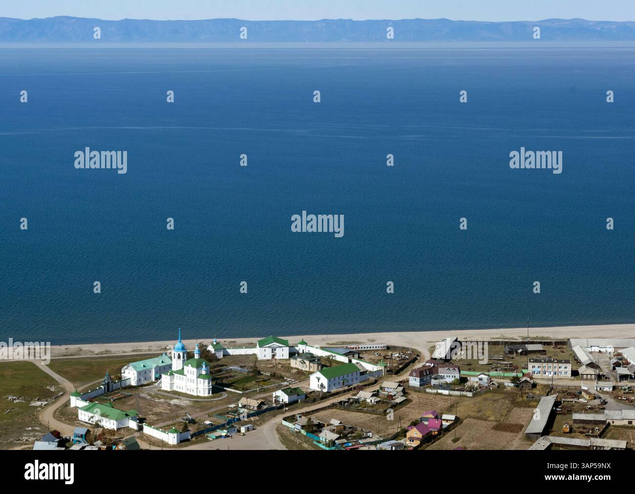 Aerial view of a picturesque village by the tranquil Baikal Lake with ...