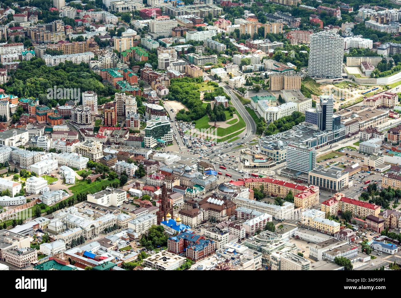 Aerial view of beautiful cityscape with highrise buildings and greenery ...