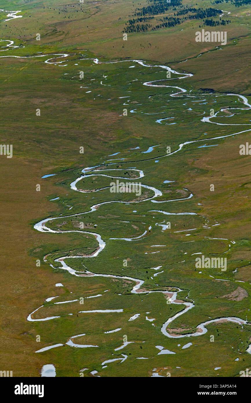 Aerial view of serene spoki hills with winding river and lush green ...