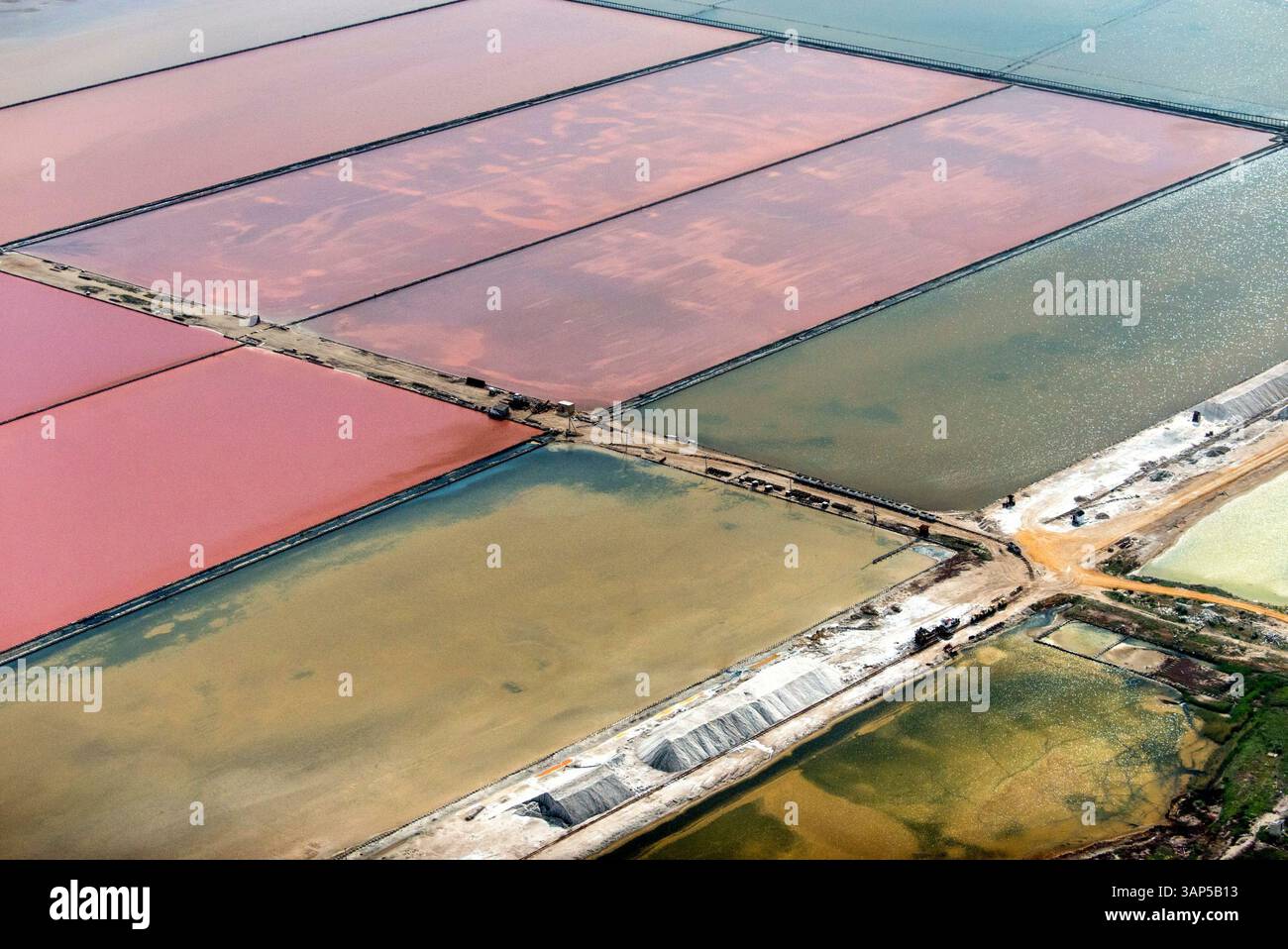 Aerial view of colorful salt ponds and wetlands with abstract patterns ...