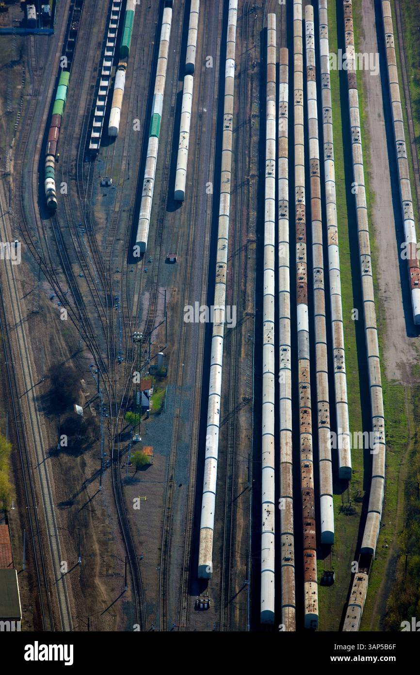 Aerial view of an industrial train yard with railway tracks and cargo ...
