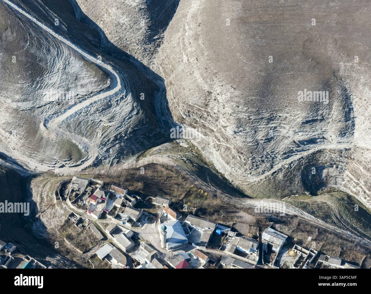 Aerial view of a beautiful mountain village surrounded by serene ...