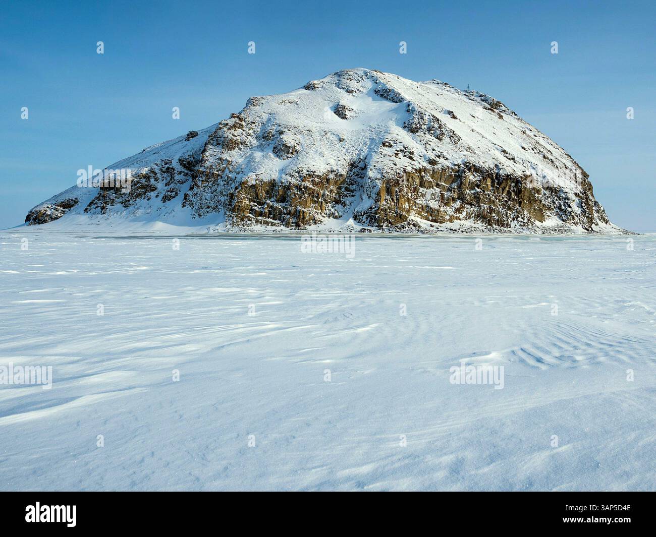 Aerial view of the majestic Verkhoyansk Range mountains covered in snow ...