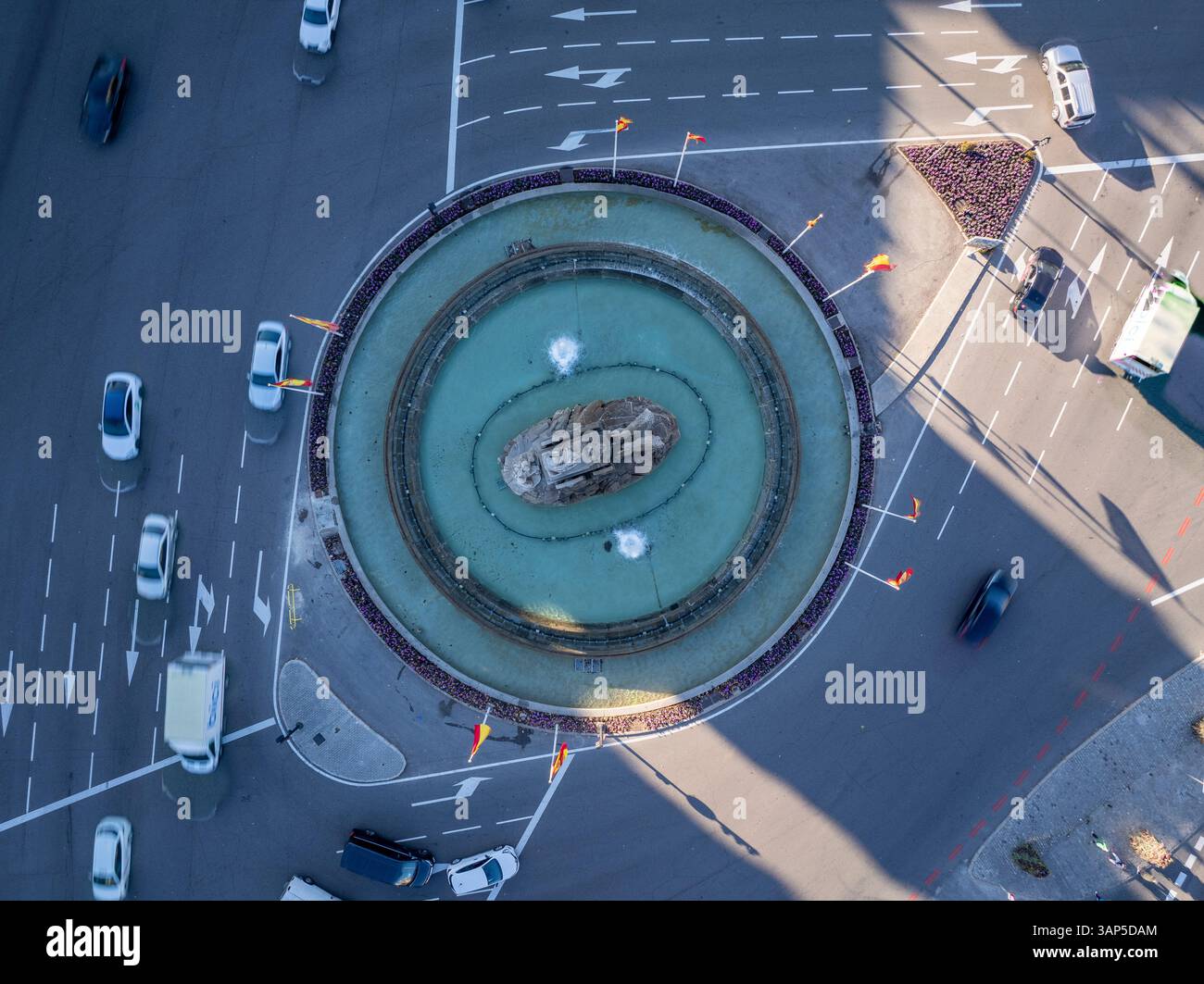 Aerial view of busy Plaza Cibeles with vibrant traffic and beautiful ...