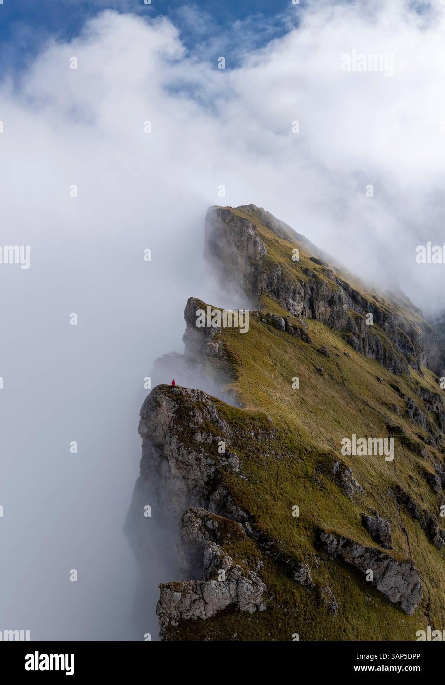 Aerial view of majestic seceda mountain with dramatic cliffs and clouds ...