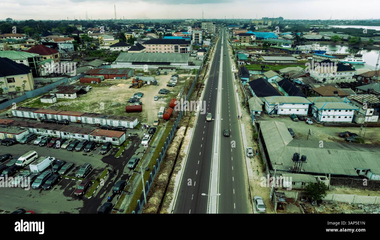 Aerial view of bustling urban landscape with modern buildings and busy roads, Port Harcourt ...