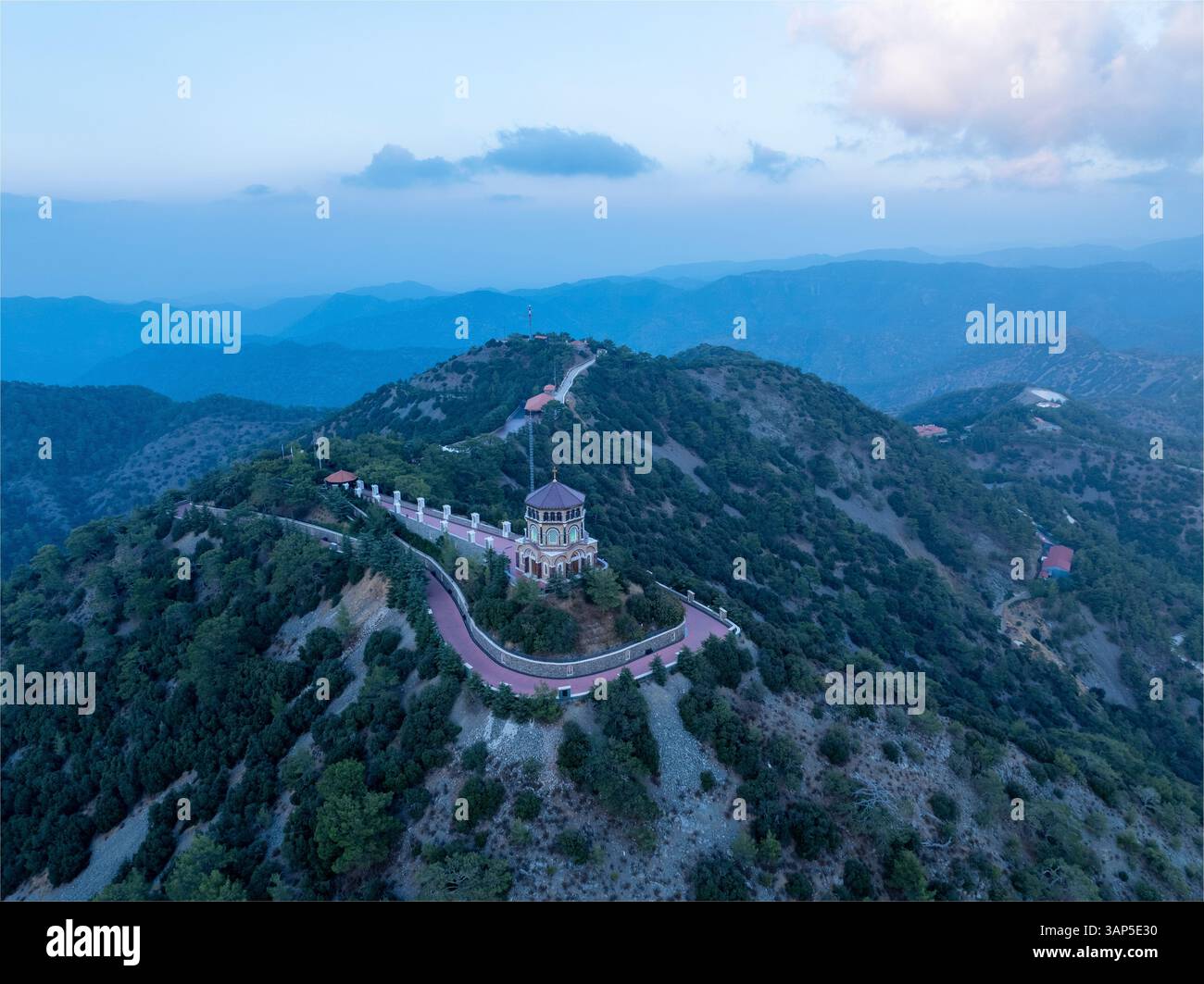 Aerial view of throni church surrounded by serene mountains and lush ...