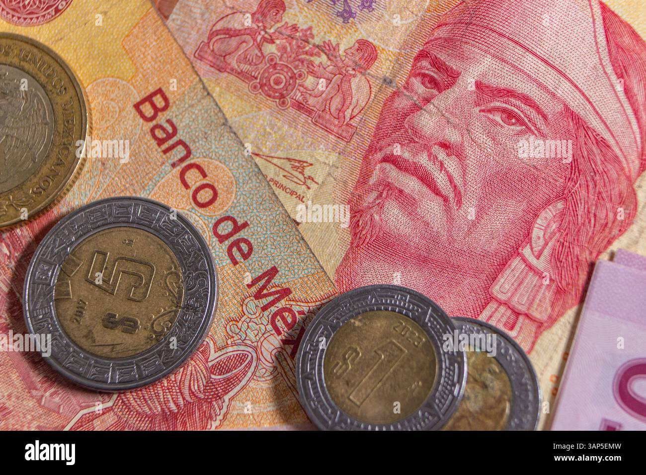 Detailed view of Mexican currency including peso banknotes and coins ...