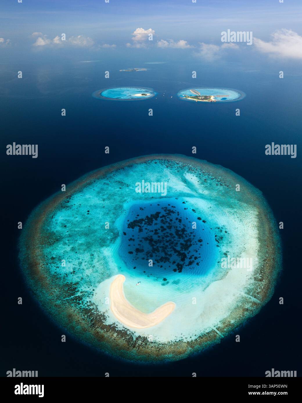 Aerial view of scattered islands on the Indian Ocean at Maldives ...