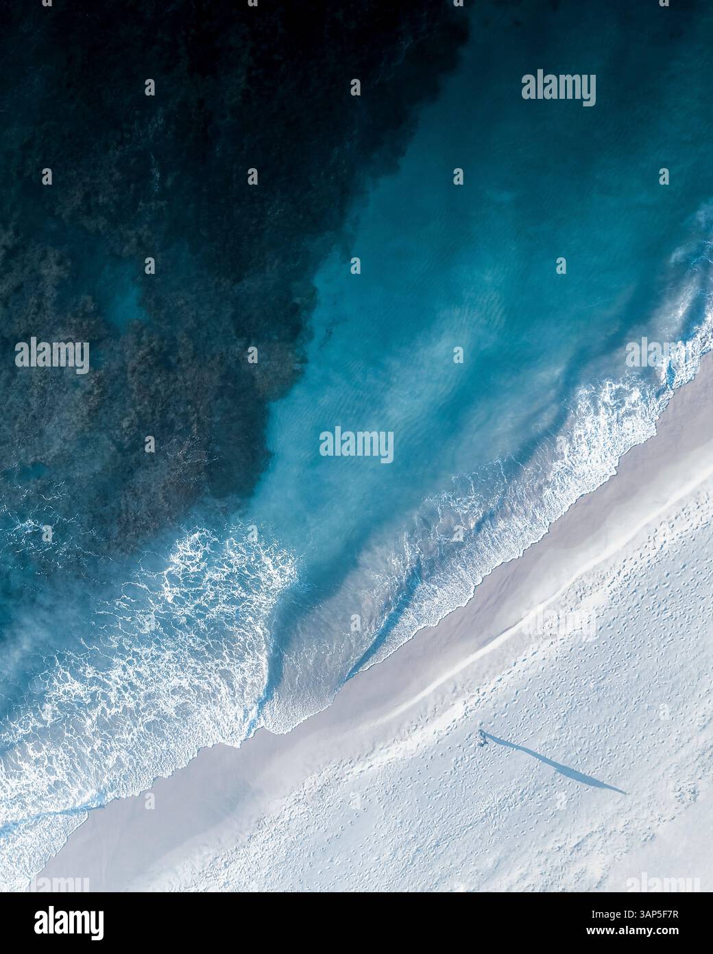 Aerial view of a person at Cottesloe Beach along the shore, Perth ...