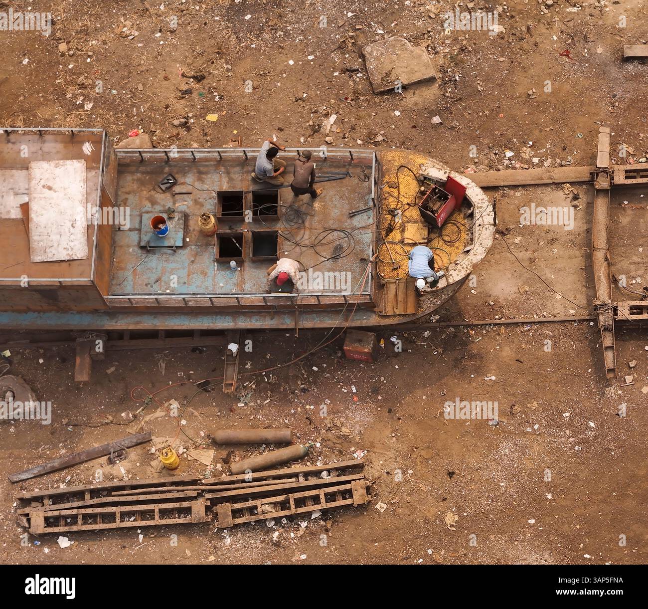 Aerial view of a busy dockyard with ships and vessels under ...