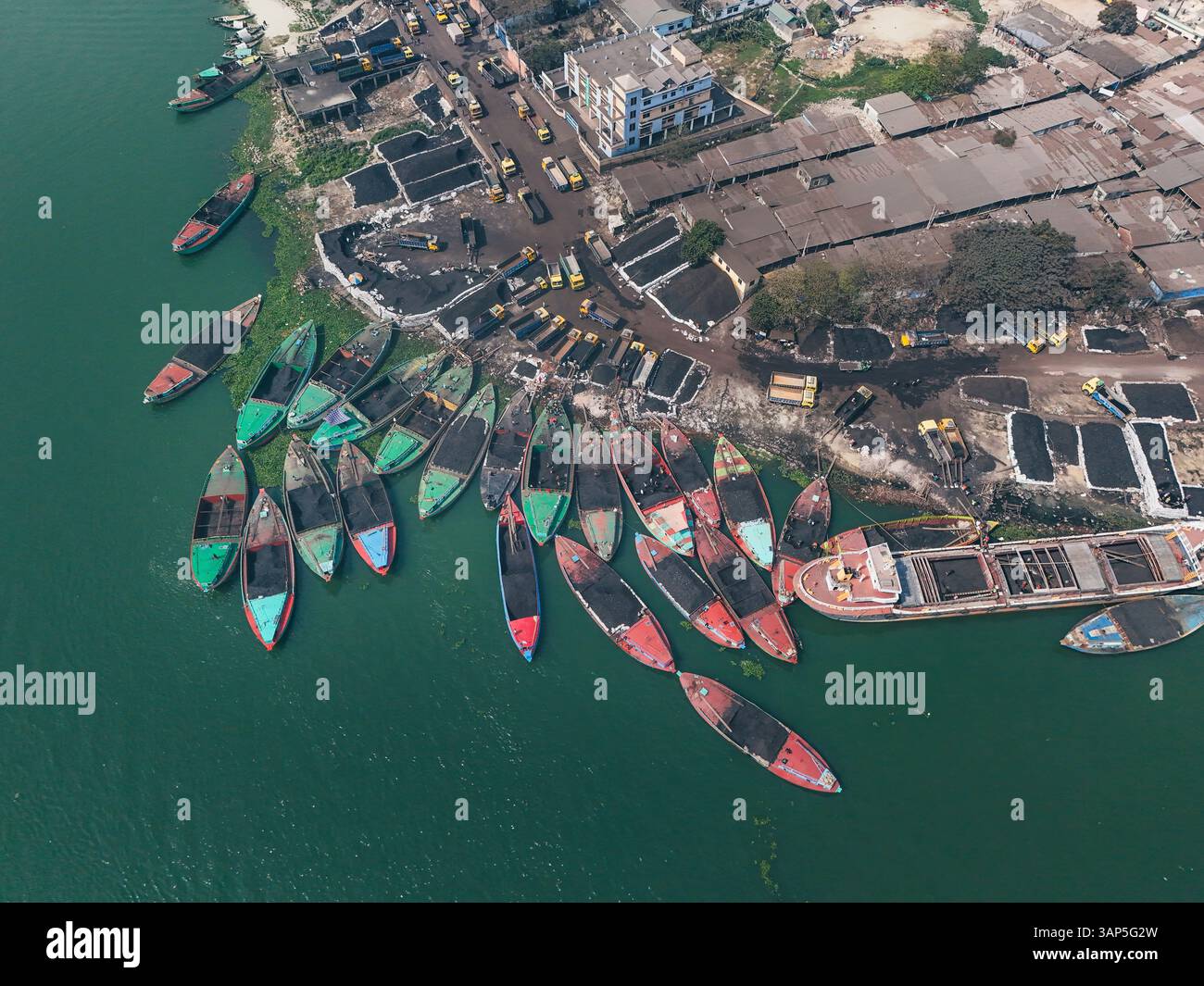 Aerial view of bustling coal dock with boats and urban landscape, Dhaka, Dhaka, Bangladesh Stock ...
