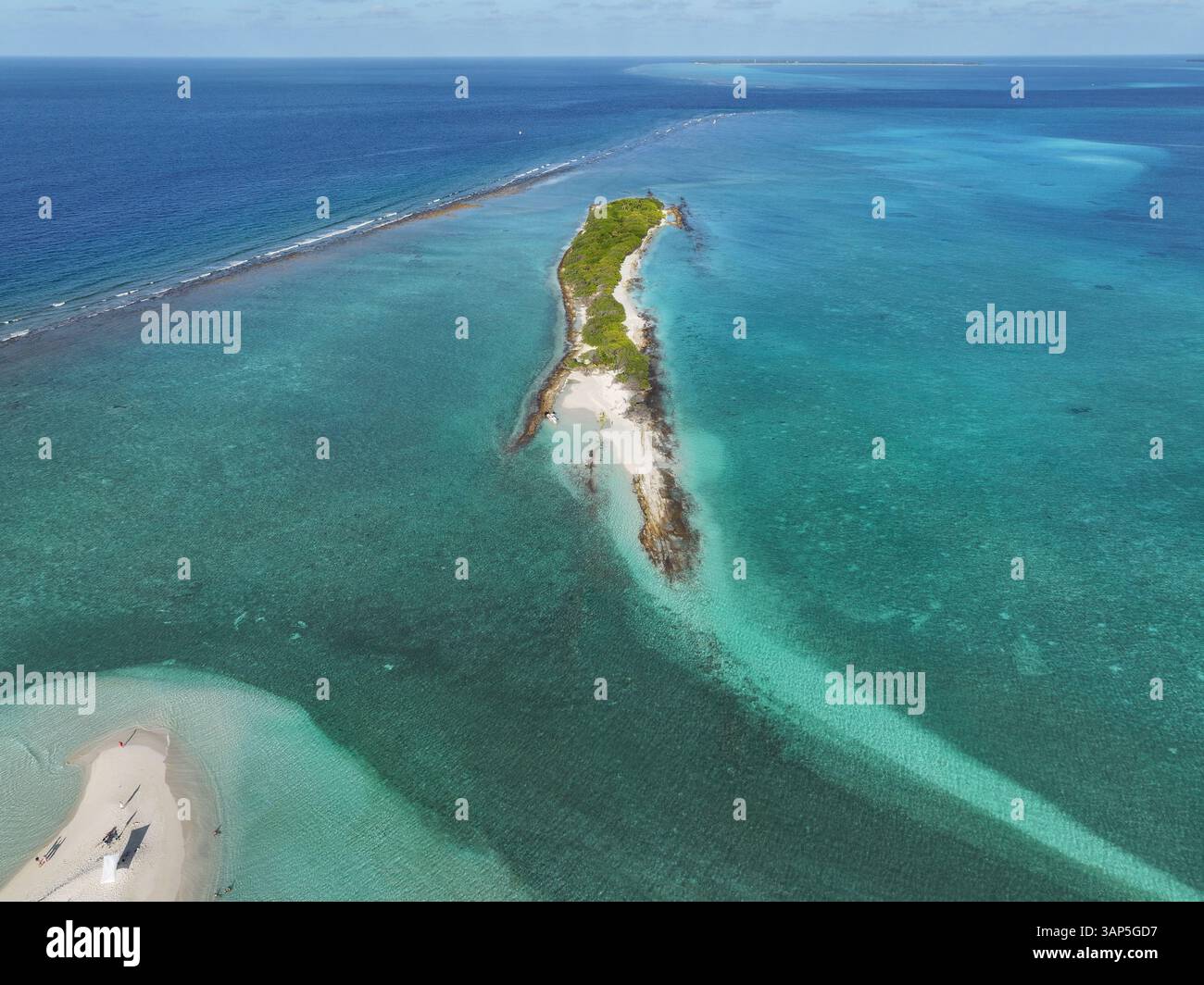 Aerial view of a beautiful tropical island with crystal clear turquoise ...