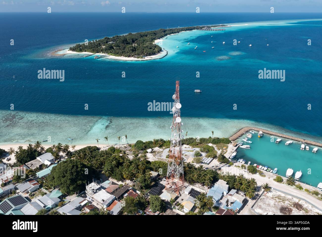 Aerial view of beautiful tropical island with resort and reef in the ...