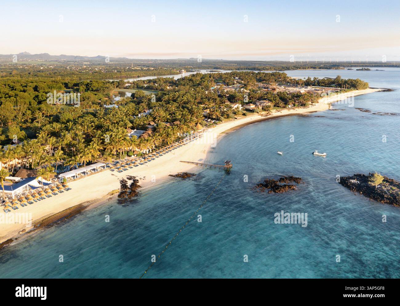 Aerial view of beautiful white sand beach and azure ocean with palm ...