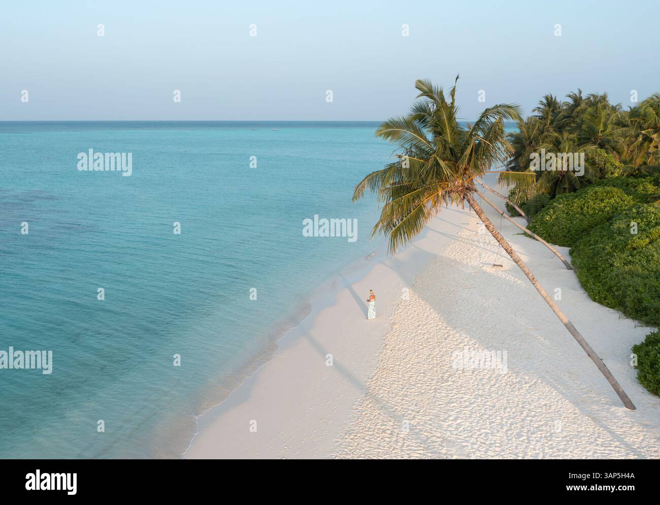 Aerial view of a beautiful tropical beach with white sand and turquoise ...