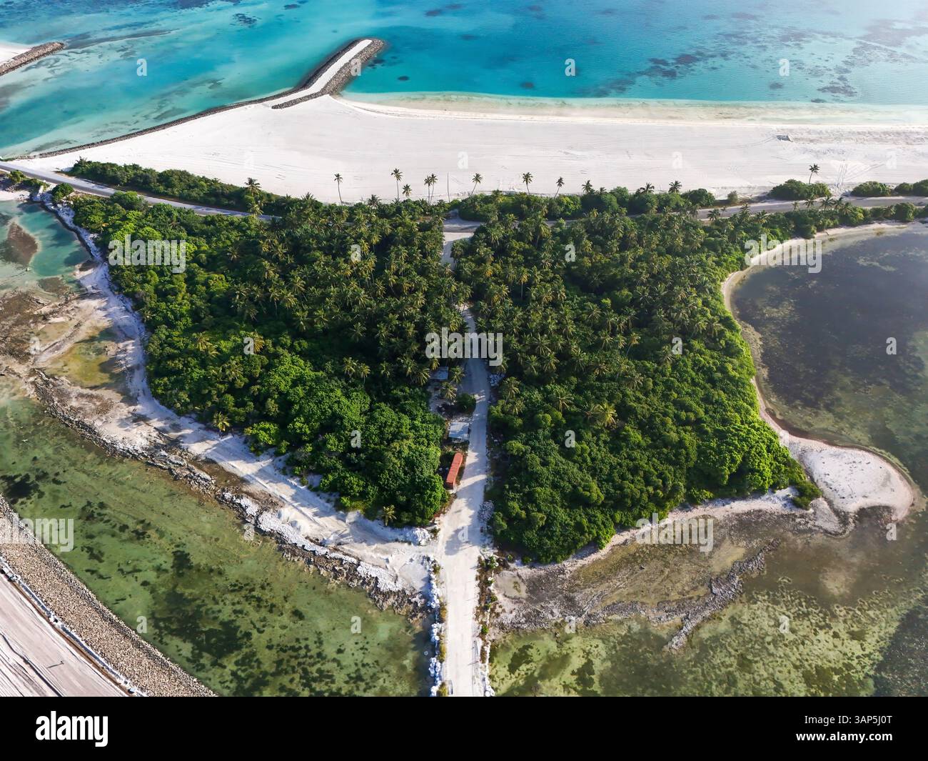 Aerial view of reclamation and dredging project in Addu Atoll, Maldives ...