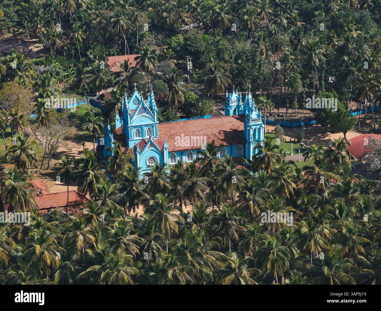 Aerial view of green agricultural fields near Our Lady of Good Voyage ...