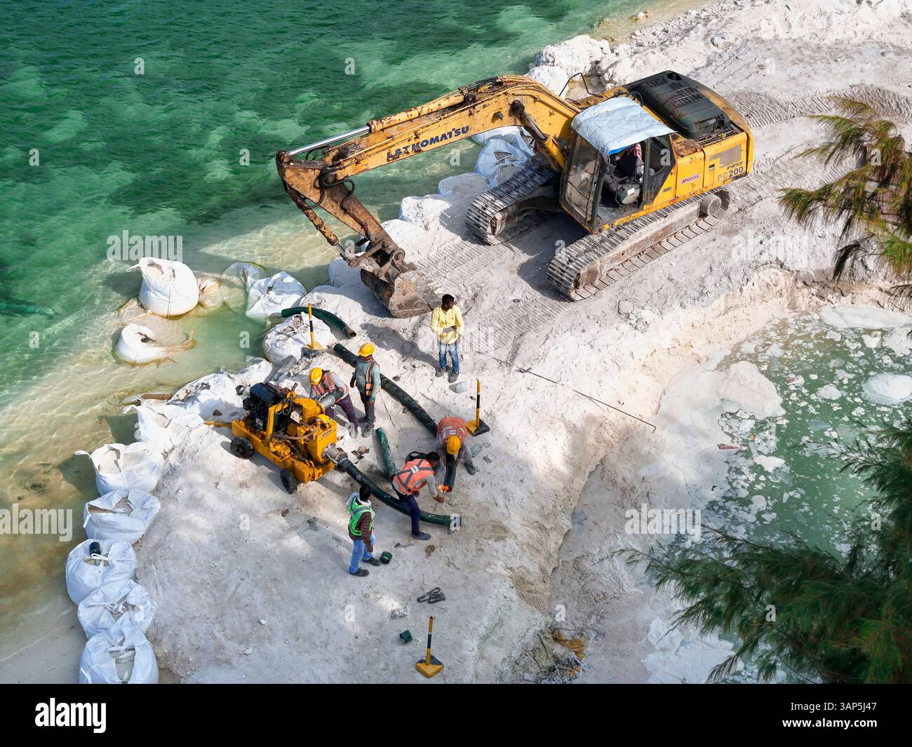 Aerial view of construction and dredging project in Addu Atoll ...