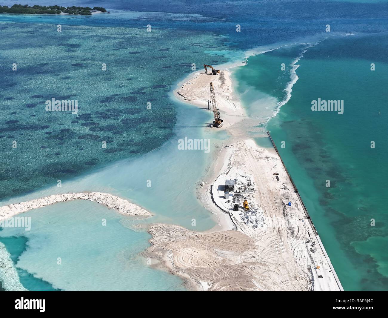 Aerial view of coastal reclamation and construction in Addu Atoll ...
