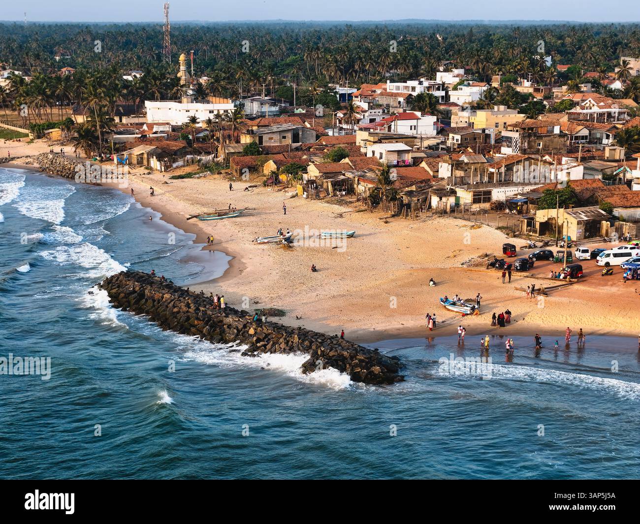 Aerial view of sandy beach with blue ocean waves, Negombo, Sri Lanka ...