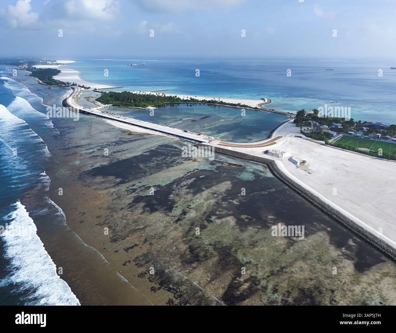 Aerial view of beautiful coastline with reclamation and construction in ...
