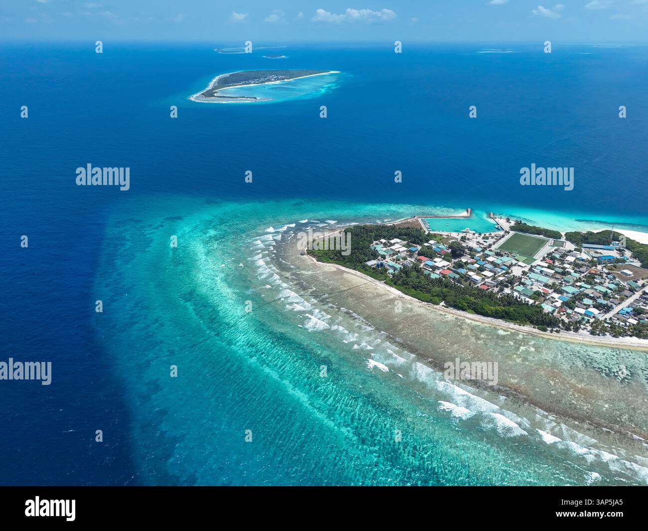 Aerial view of luxury resort on Thuraakunu island, Haa Alif, Maldives ...