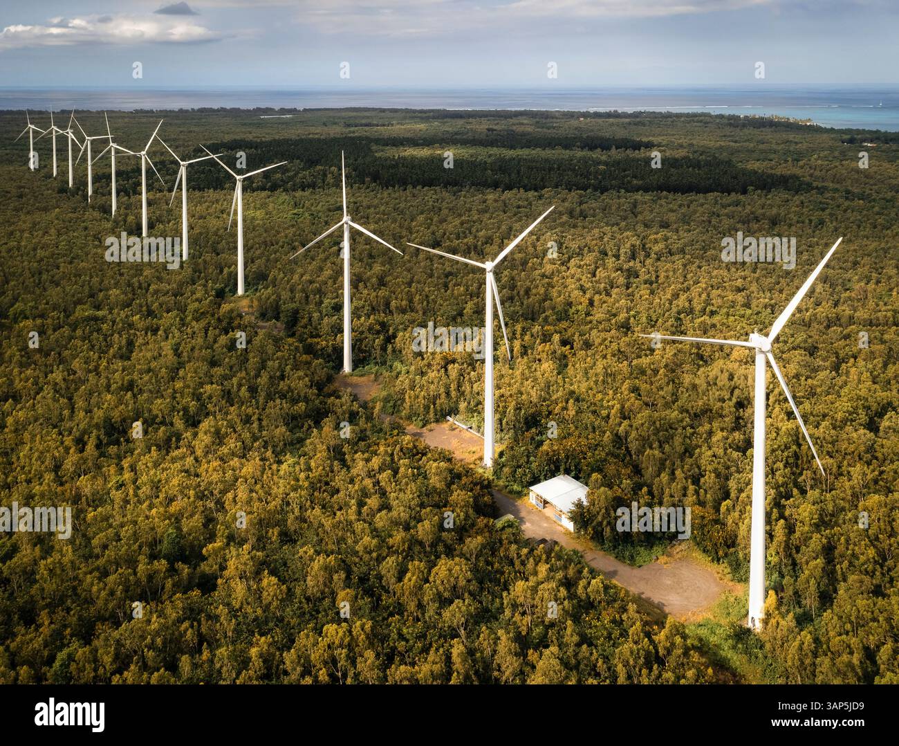 Aerial drone view of wind turbines in a tropical forest, Bras d'Eau ...