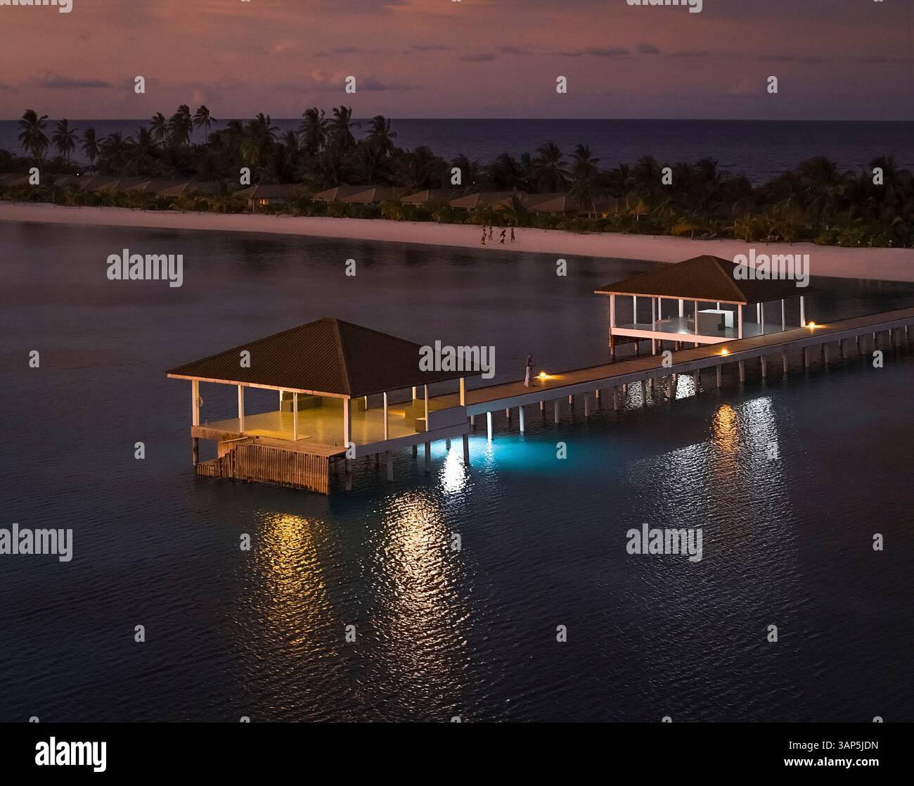 Aerial view of luxury resort South Palm Resort, jetty on white sand ...