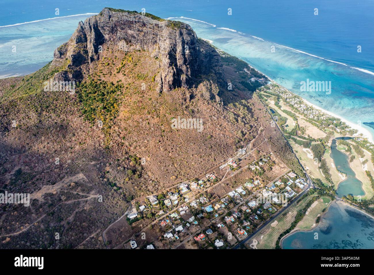 Aerial view of mount Le Morne at sunrise, Le Morne village, Mauritius ...