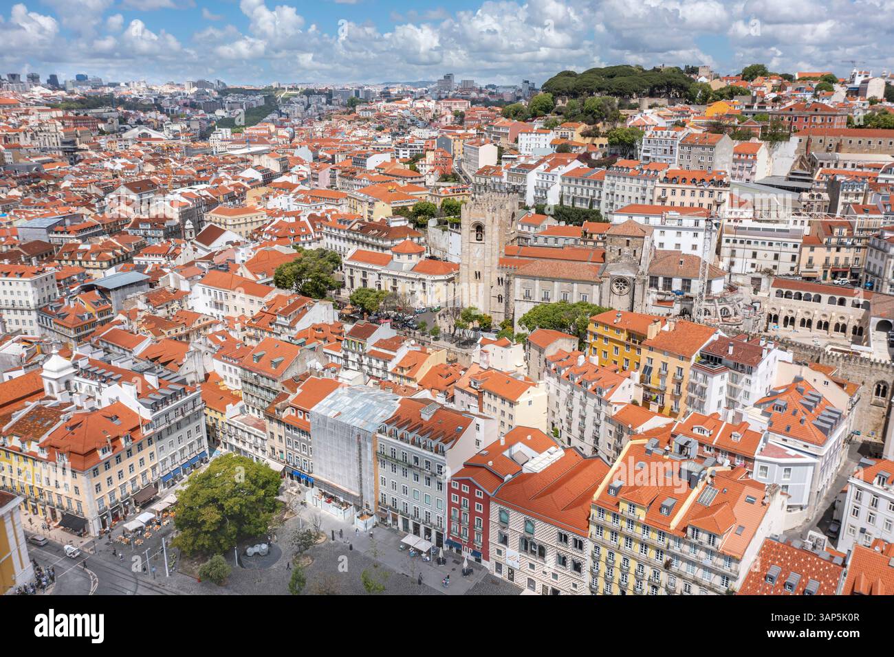Aerial view of historical houses with red roofs at golden hour, Lisbon ...