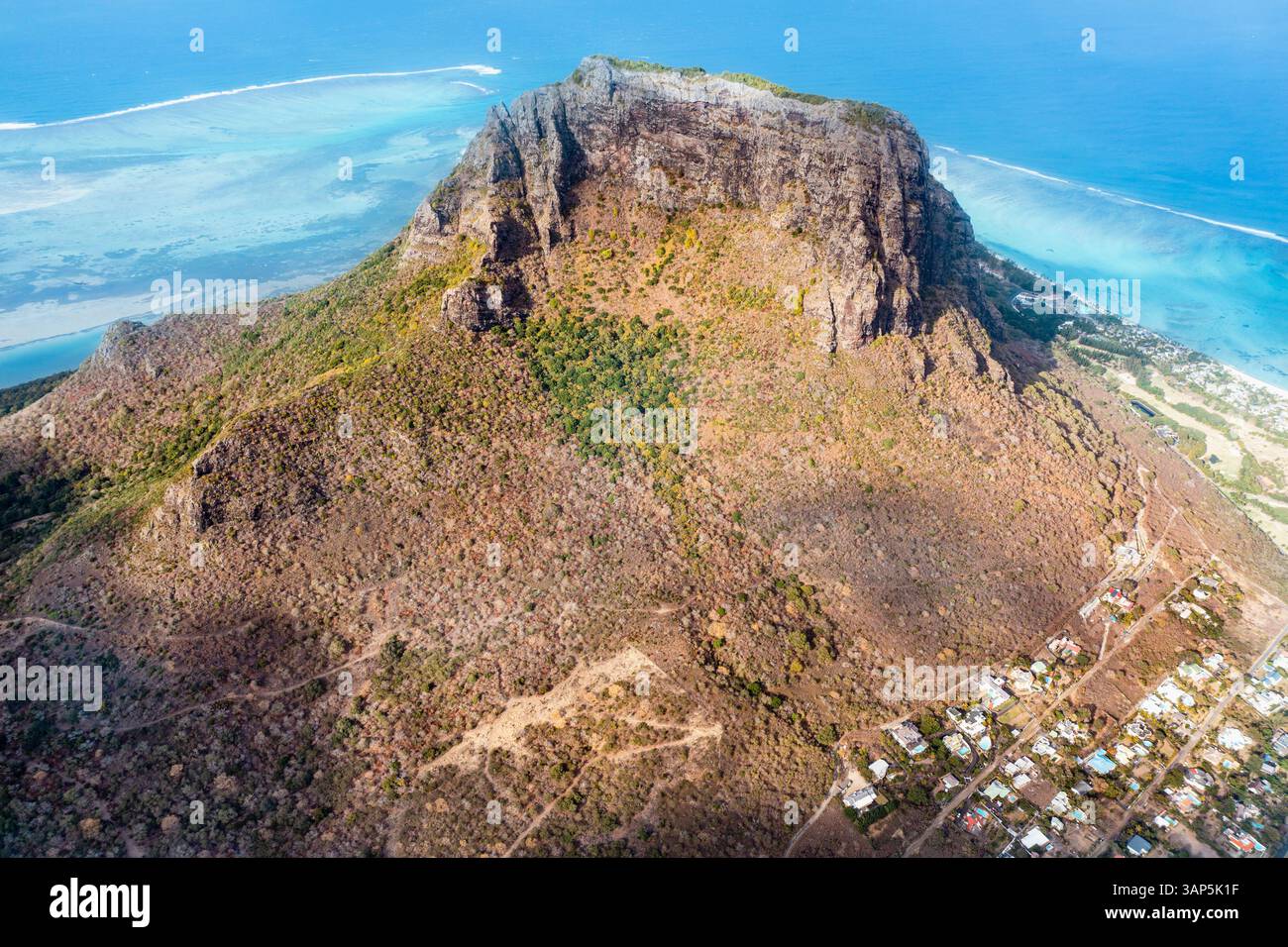 Aerial view of mount Le Morne at sunrise, Le Morne village, Mauritius ...