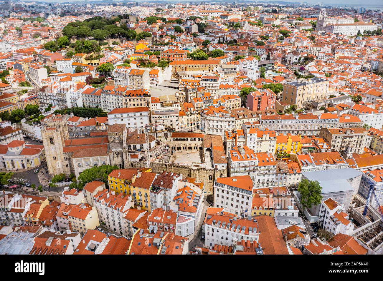 Aerial view of historical houses with red roofs at golden hour, Lisbon ...