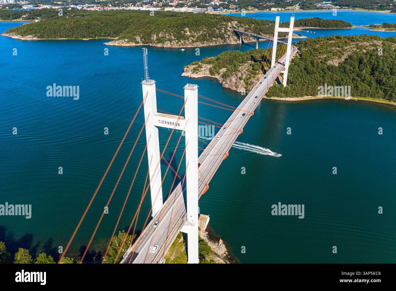 Panoramic aerial view of Tjörnbron suspension bridge with passing cars ...