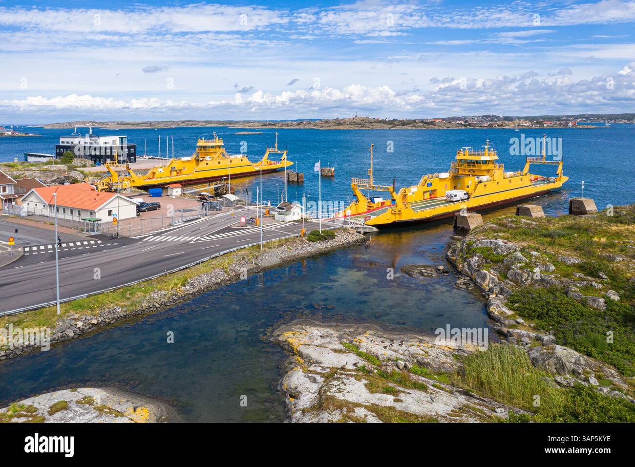 Aerial view of the ferry terminal with two yellow car ferries, Hönö ...